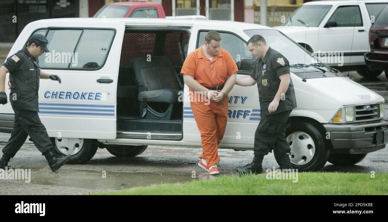 Riverton High School senior Charles "Coy" New, 18, is led to a hearing ...