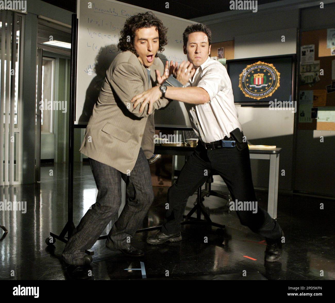 FBI agent Don Eppes, right, played by Rob Morrow, pushes his brother ...