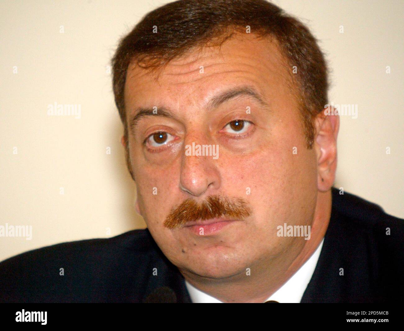 Azerbaijani President, then Prime Minister, Ilham Aliev, speaks to the ...