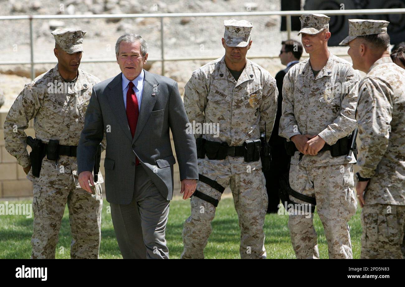 President Bush is photographed with Marines after attending a church ...