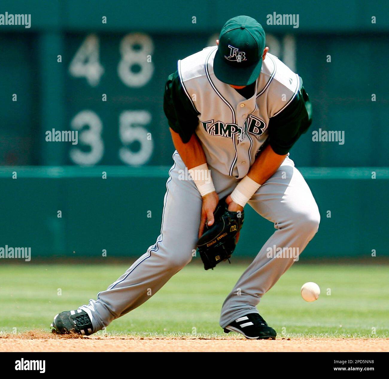 Tampa Bay Devil Rays shortstop Tomas Perez commits an error while ...