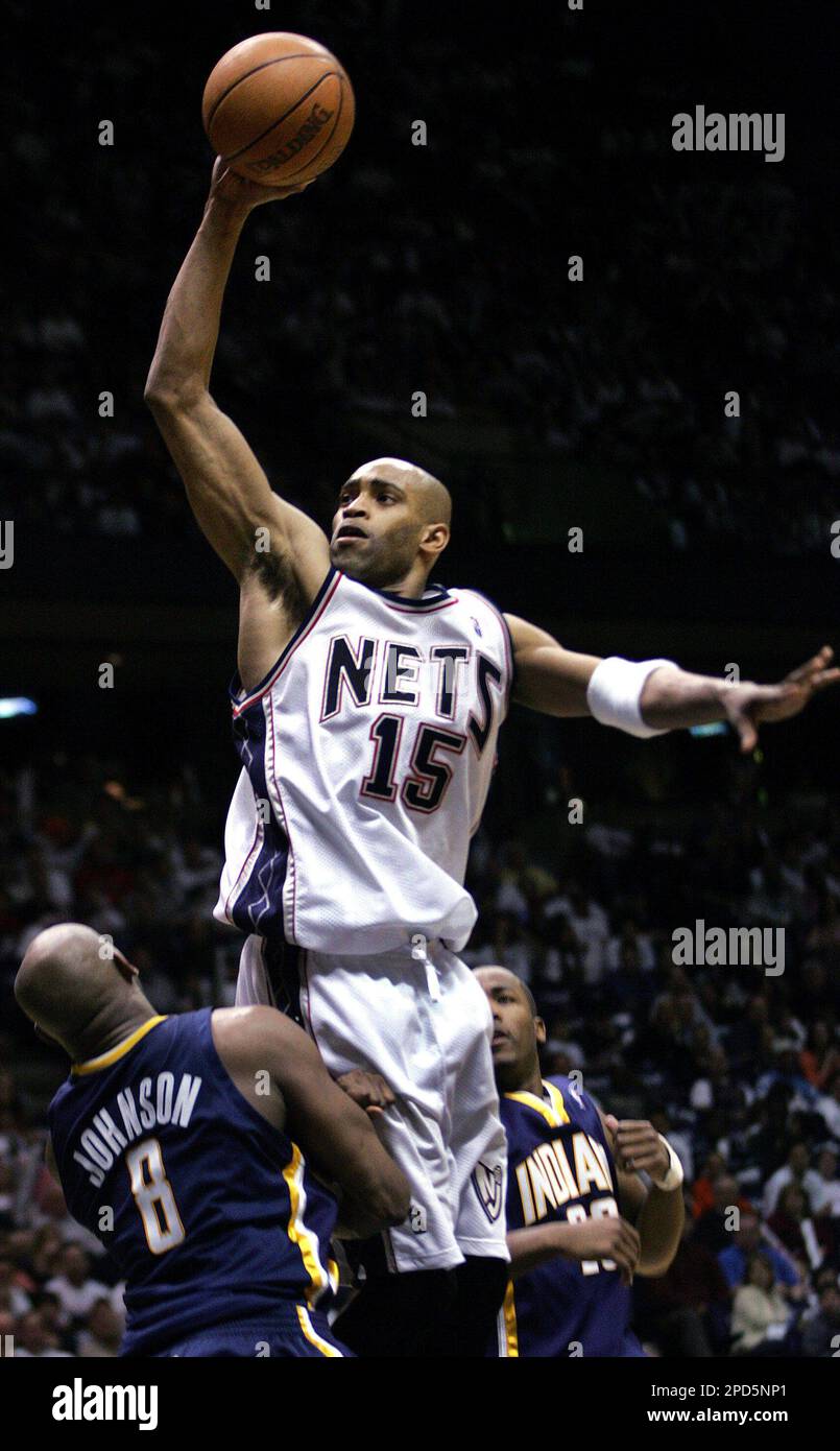 New Jersey Nets Vince Carter shoots a basket as he hits Indiana Pacers ...