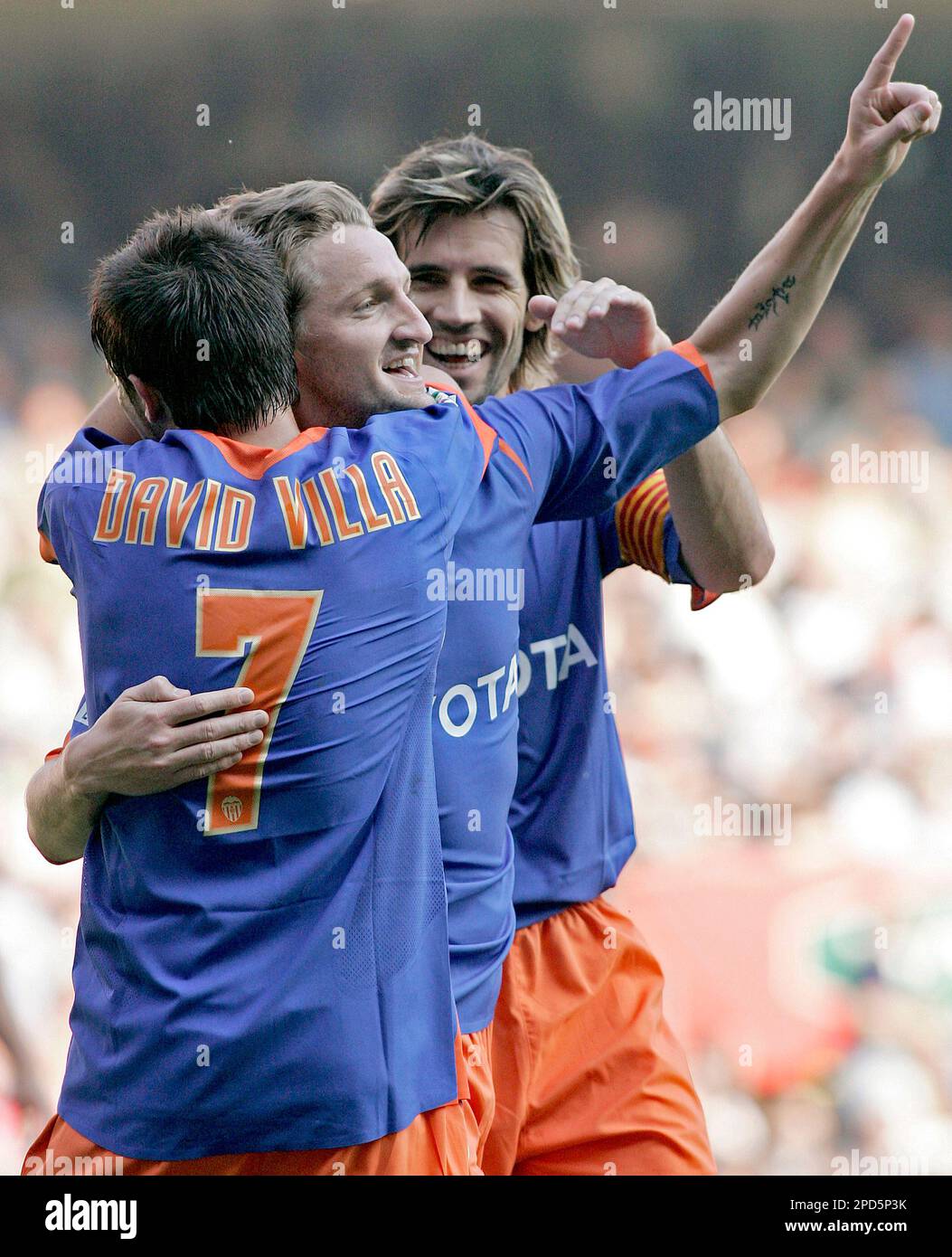 Valencia players Miguel Angel Mista, center, David Albelda, right, and ...