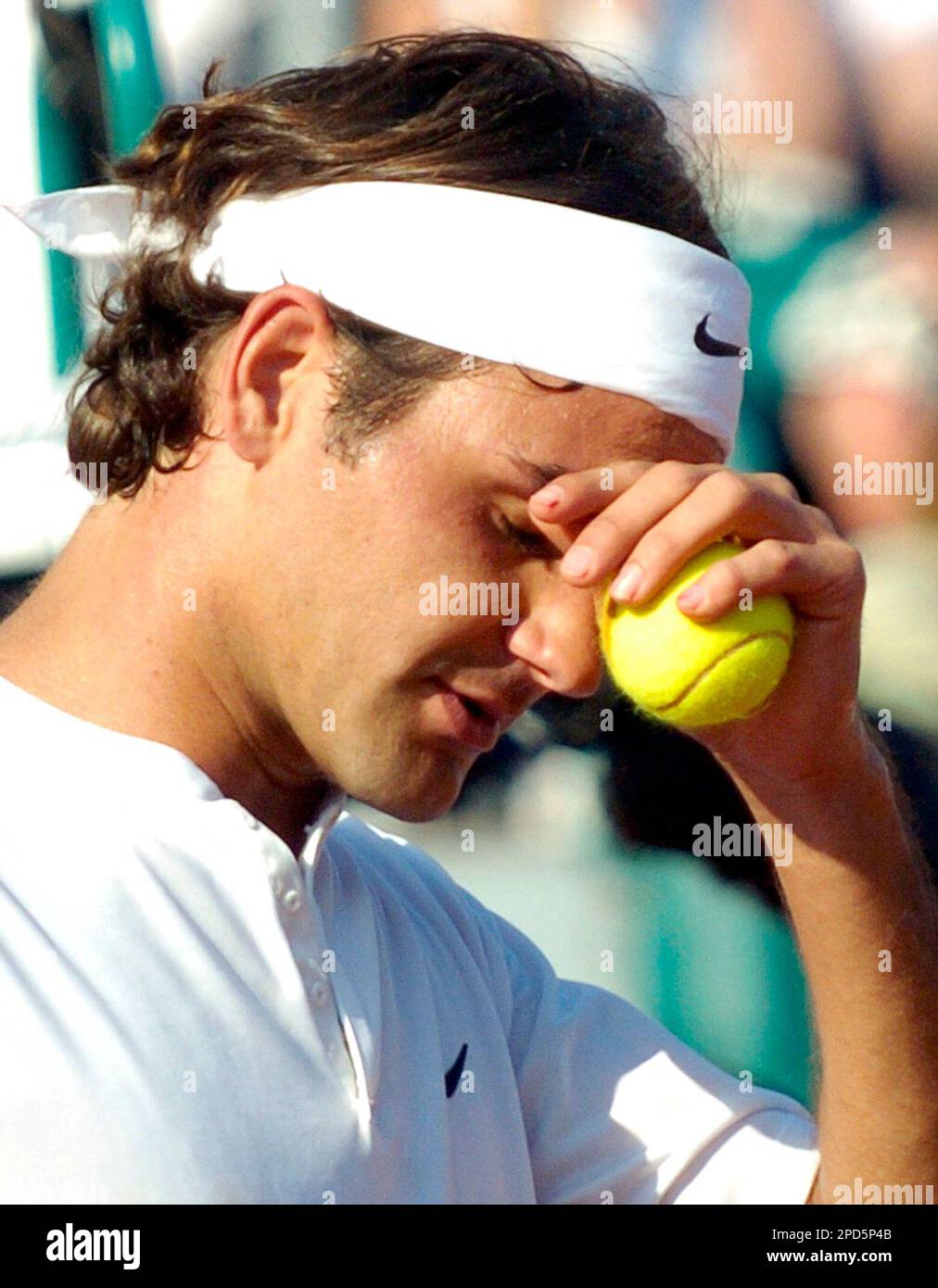 Roger Federer of Switzerland reacts after losing a point to Rafael ...