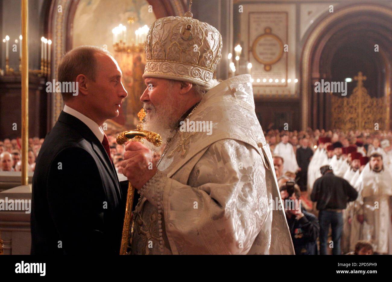 President Vladimir Putin, left, listens to Russian Orthodox Patriarch ...