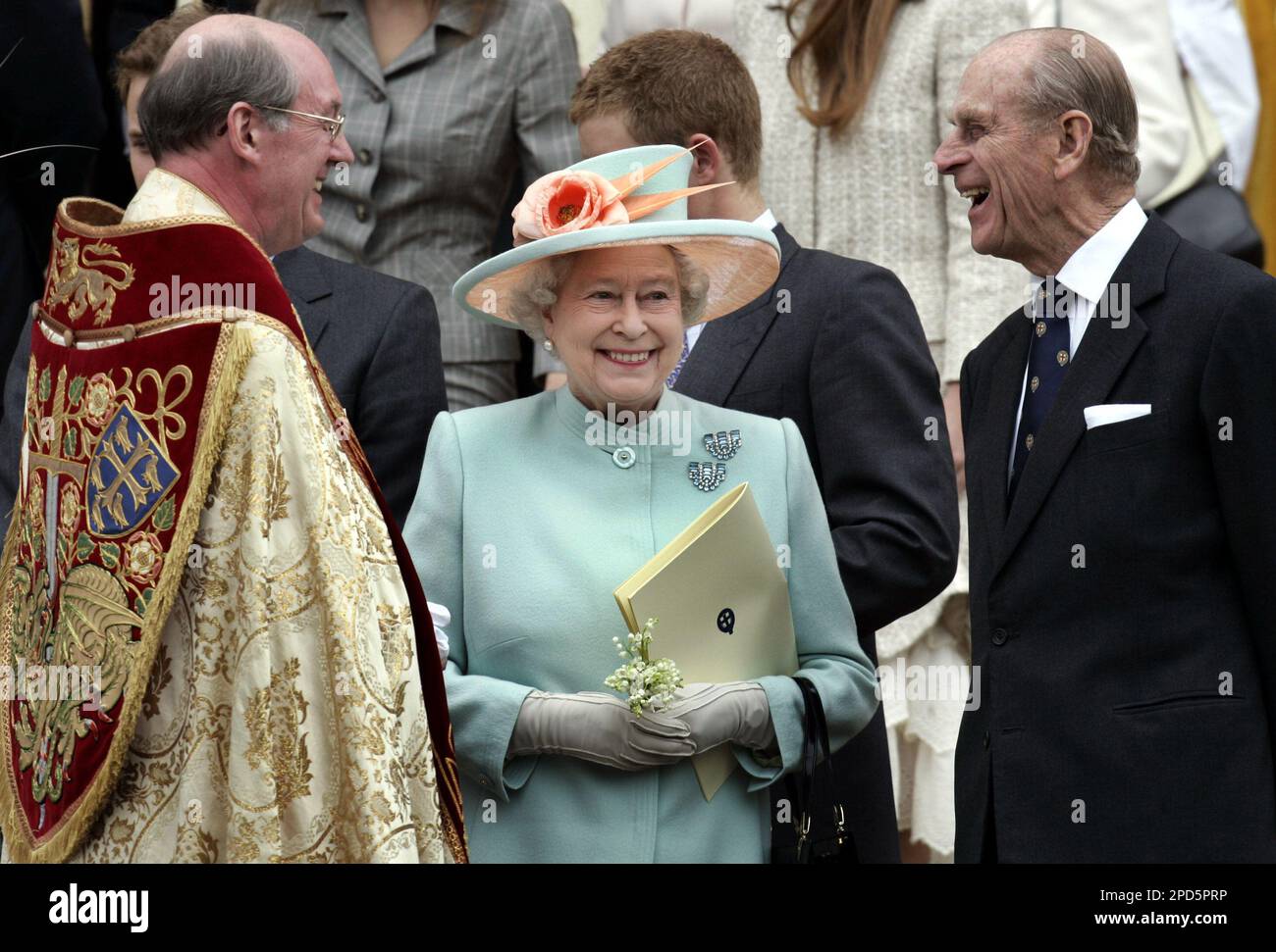 Britain's Queen Elizabeth II, center, accompanied by her husband Prince ...