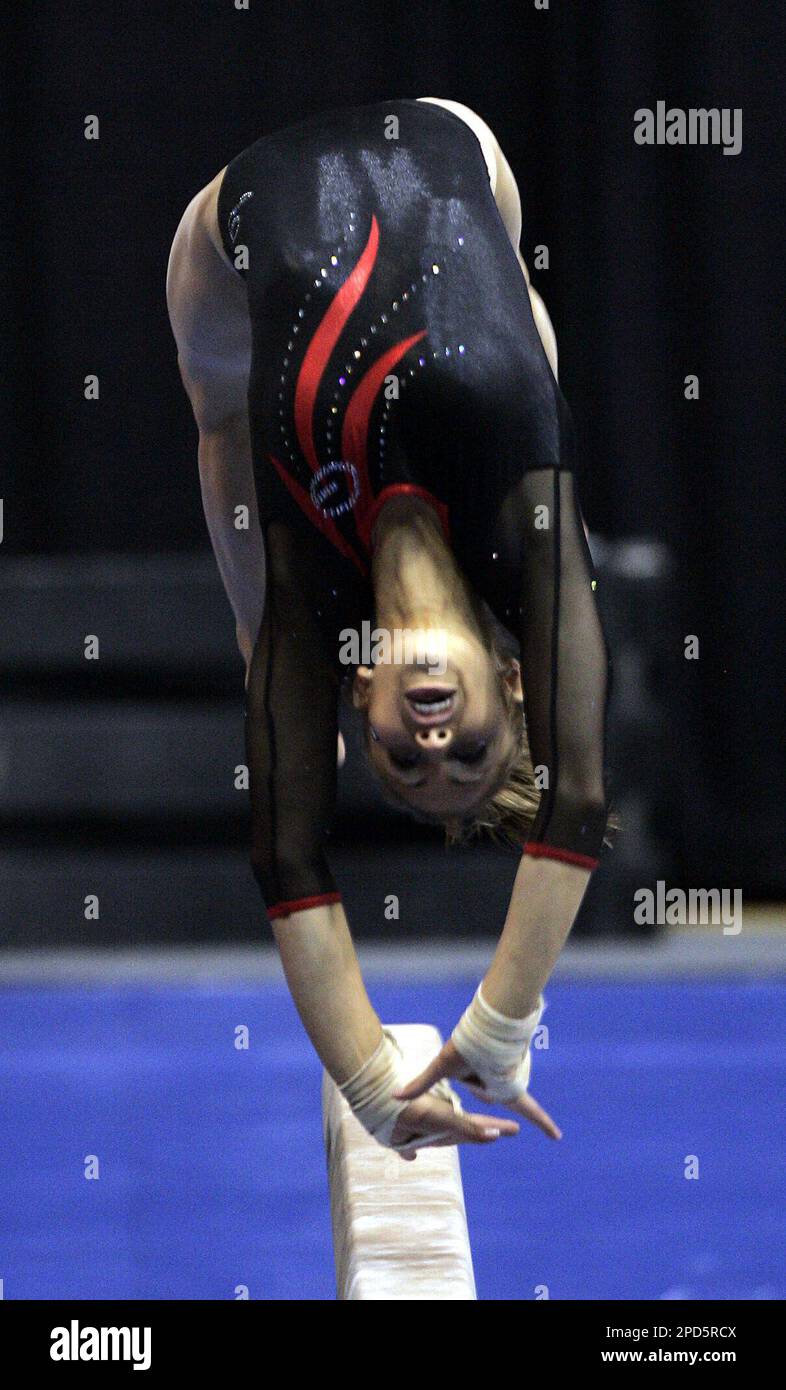 Georgia's Courtney Kupets does a backflip on the balance beam during ...