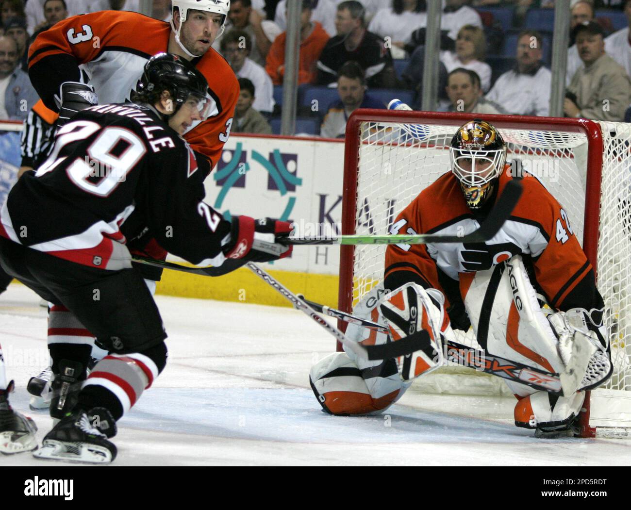 Buffalo Sabres' Jason Pominville (29) battles for a shot against ...