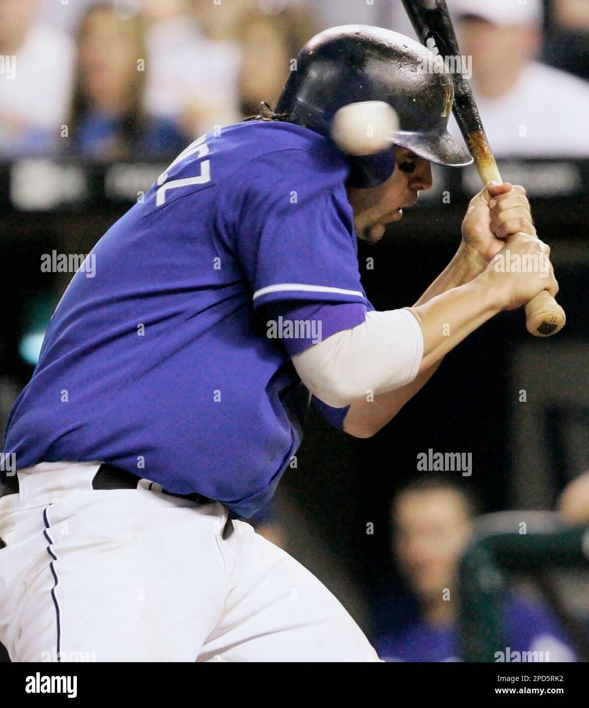 Kansas City Royals' Doug Mientkiewicz is hit in the helmet by a pitch ...