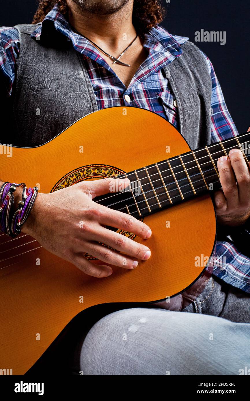 Close up acoustic guitar in musician hand Stock Photo - Alamy