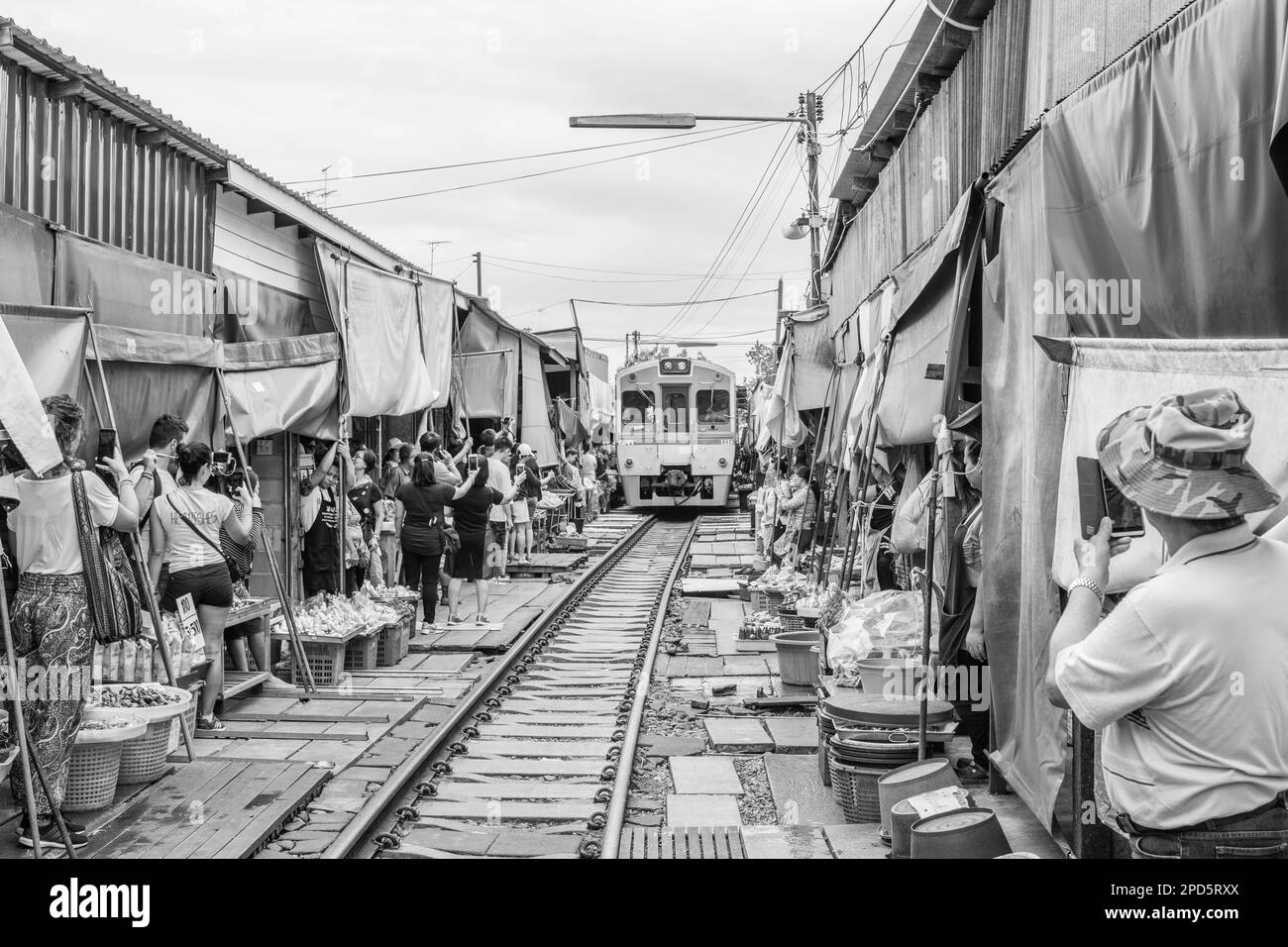 The Maeklong Railway Market or Hoop Rom near Bangkok in Thailand ...