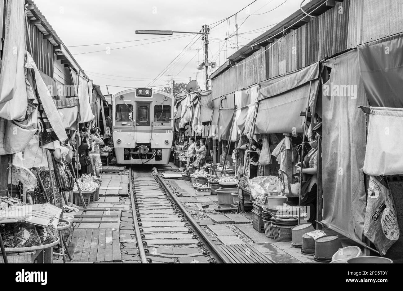 The Maeklong Railway Market or Hoop Rom near Bangkok in Thailand ...