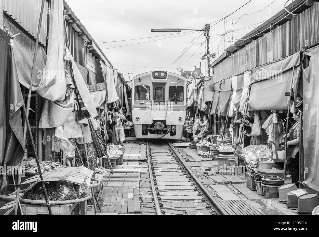 The Maeklong Railway Market or Hoop Rom near Bangkok in Thailand ...