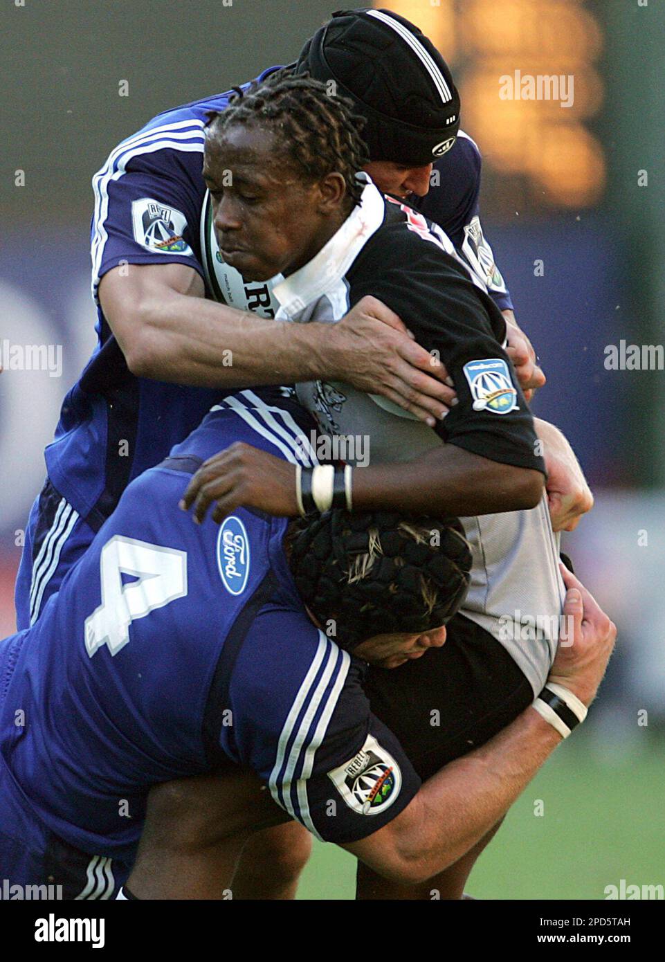 New Zealand's Blues Greg Rawlinson, 4 front, with teammate Anthony ...