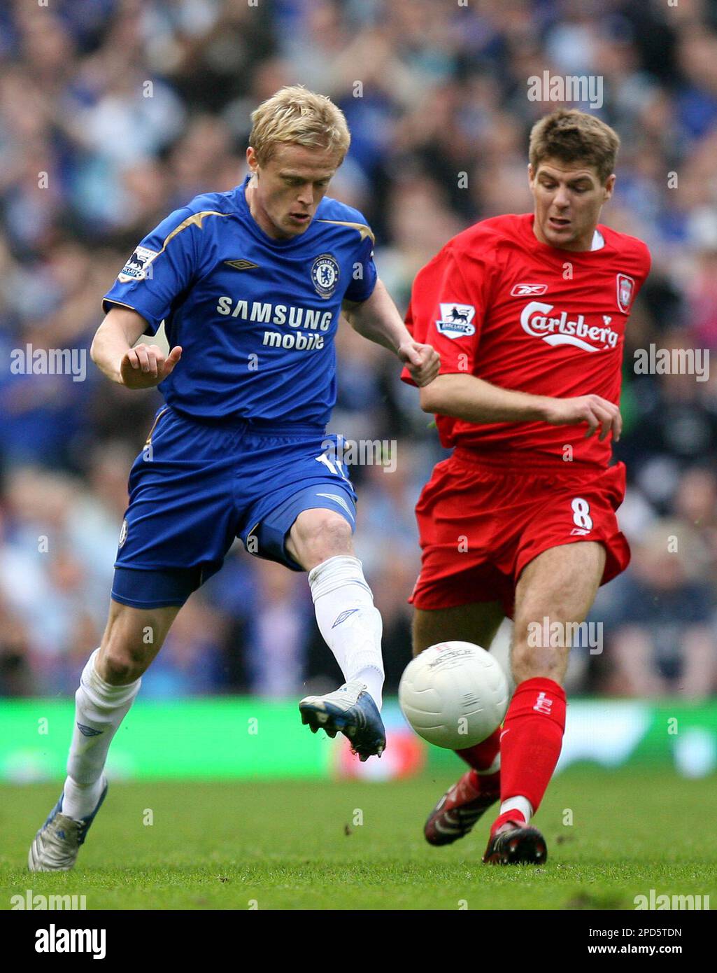 Liverpool's Steven Gerrard, right, chases down Chelsea's Damien Duff ...