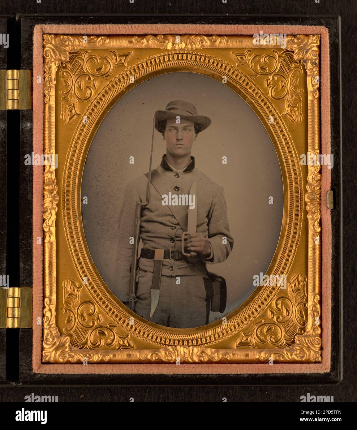 Unidentified soldier in Confederate uniform with bayoneted musket and D ...
