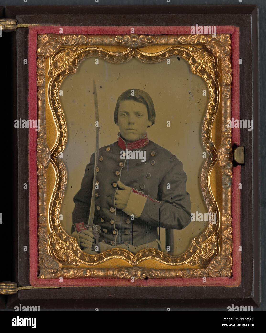 Unidentified young soldier in Confederate uniform with saber ...