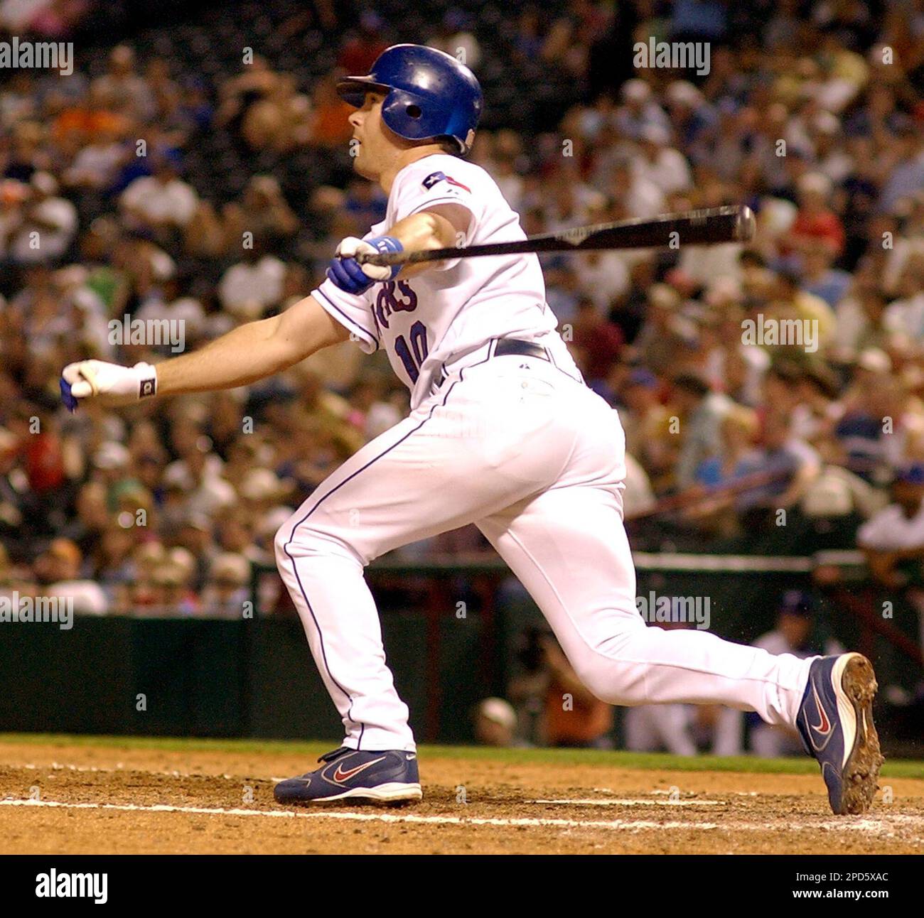 Texas Rangers' Michael Young follows through on a bases-loaded double ...