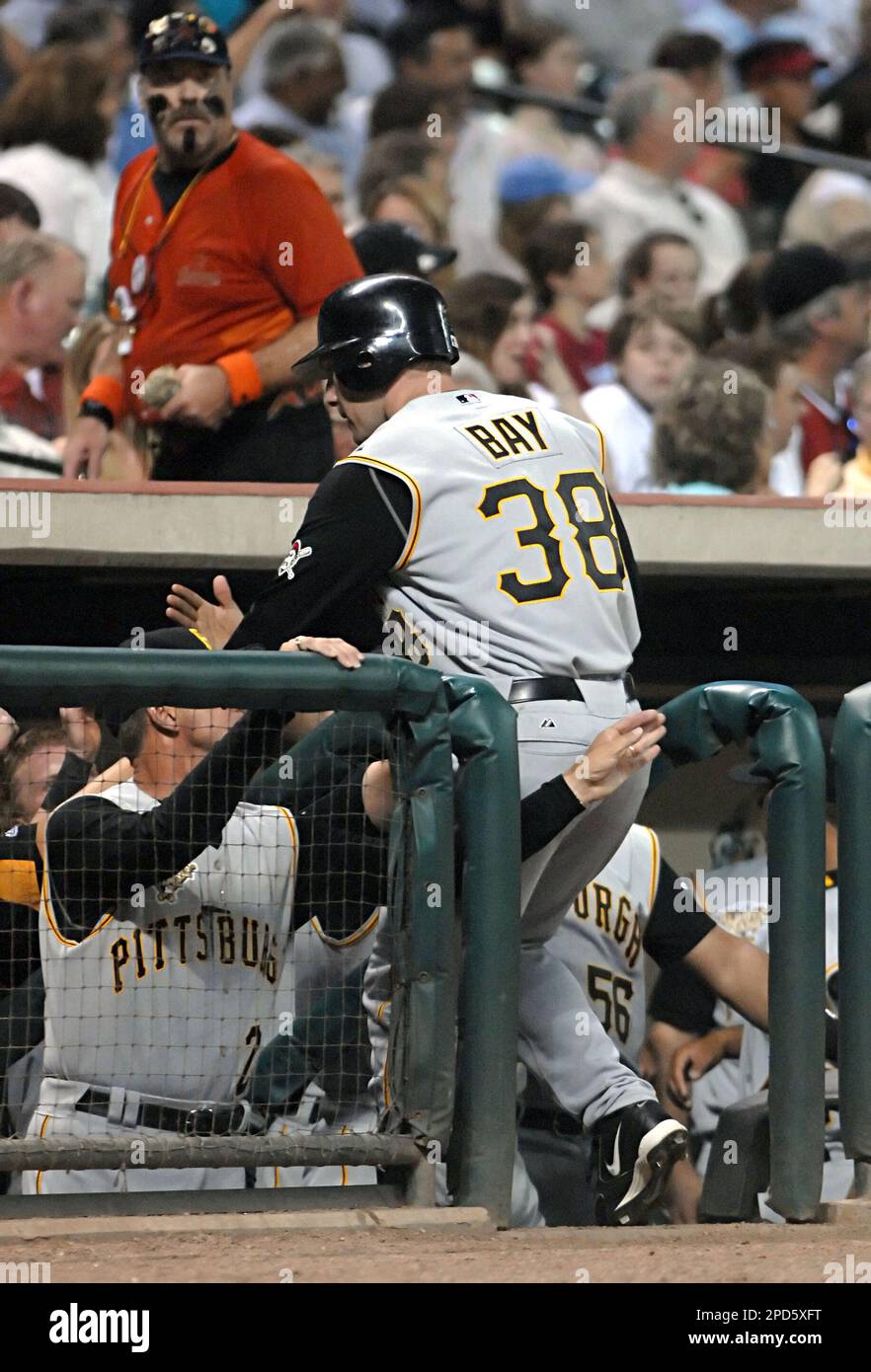 Pittsburgh Pirates Jason Bay is congratulated at the dugout after ...