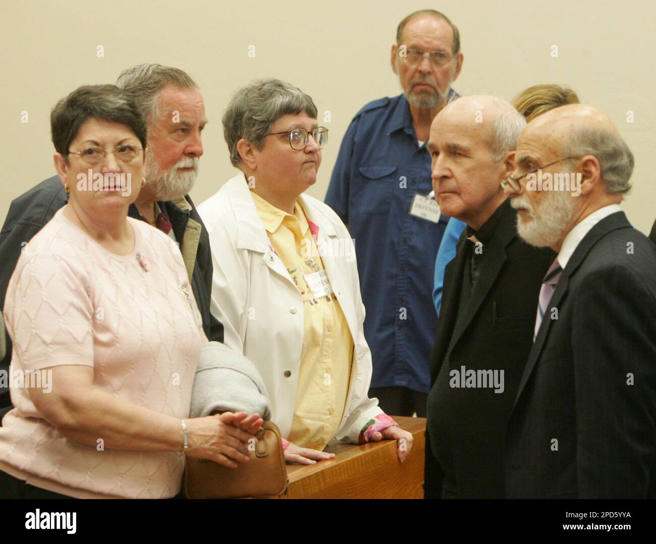 The Rev. Gerald Robinson, center and attorney Alan Konop, right, speak ...