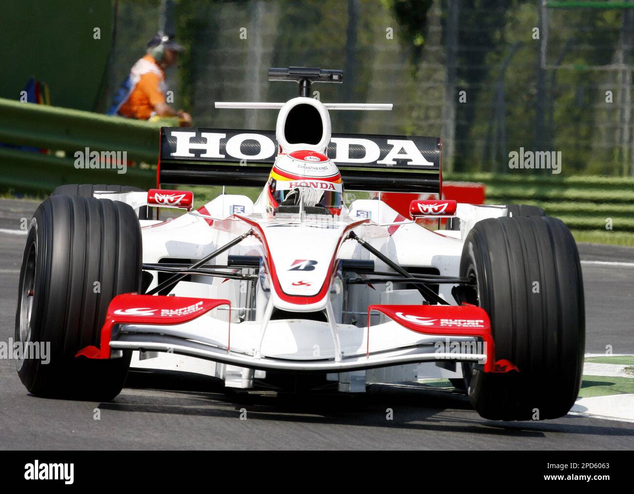 Ide Yuji of Japan steers his Super Aguri racer during free practice for ...