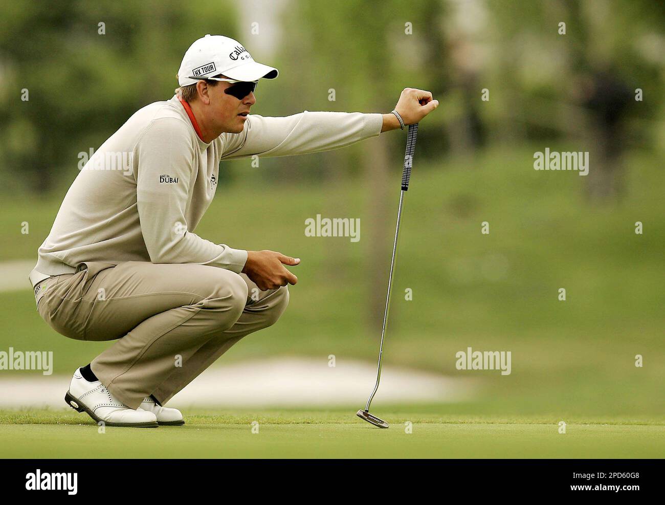 Sweden's Henrik Stenson prepares his putt at the 14th green from during ...