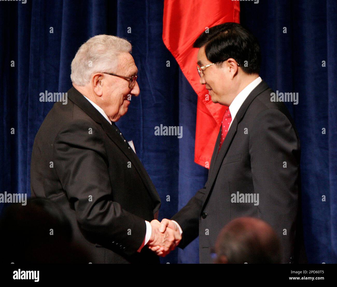 Chinese President Hu Jintao, right, is greeted by former Secretary of ...
