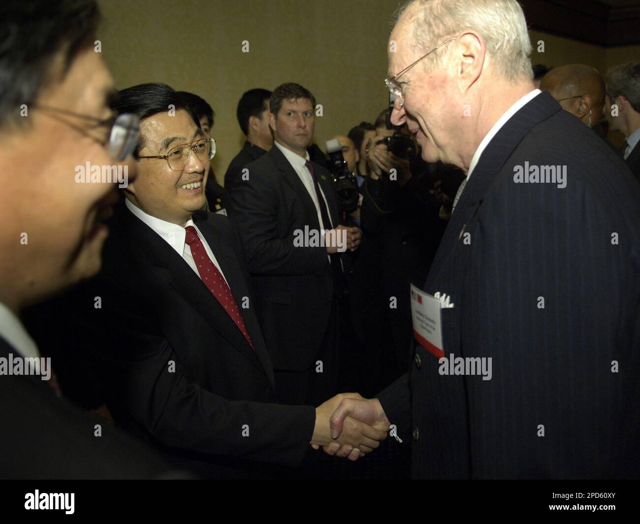 Chinese President Hu Jintao, left, greets U.S. Supreme Court Justice ...