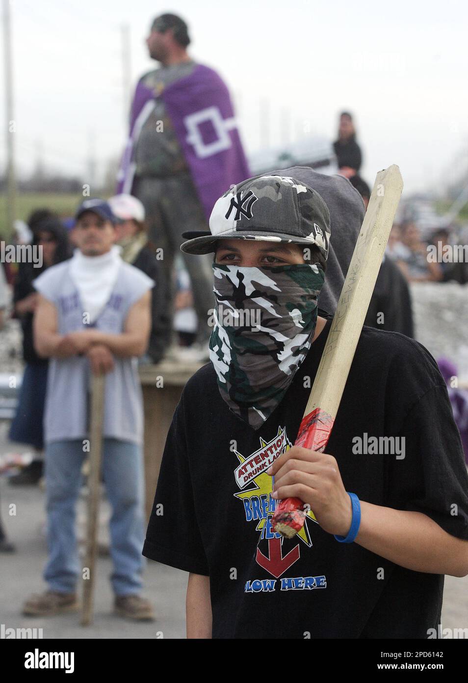 Six Nations Native protesters stand guard at a barricade by the Douglas ...