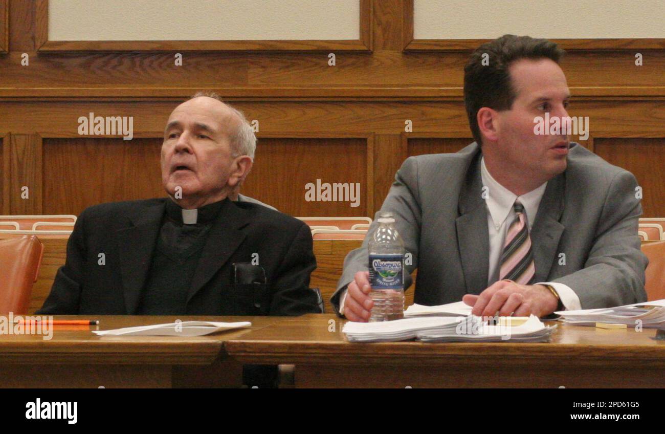 The Rev. Gerald Robinson, left, a Roman Catholic priest accused of ...