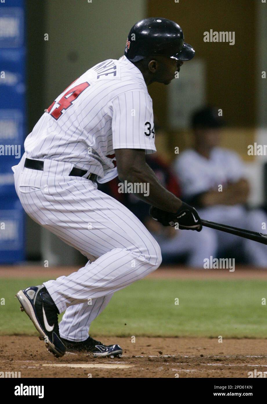 Minnesota Twins' Rondell White watches his two-run bases loaded single ...