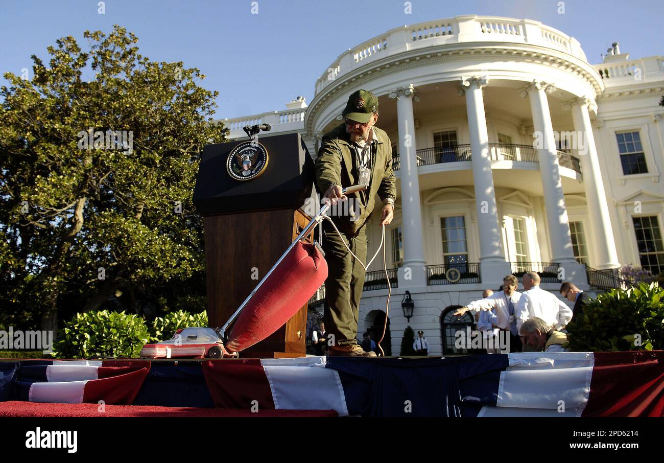 Tom Geer with the National Park Service runs a vacuum cleaner over the ...