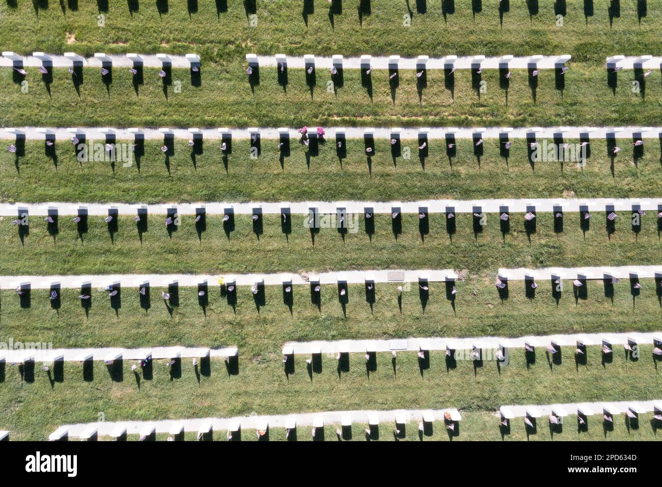 Aerial looking down on military headstones honoring armed forces ...