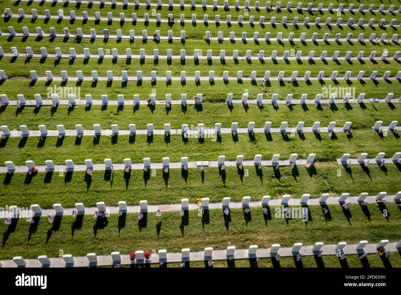 Aerial looking down on military headstones honoring armed forces ...