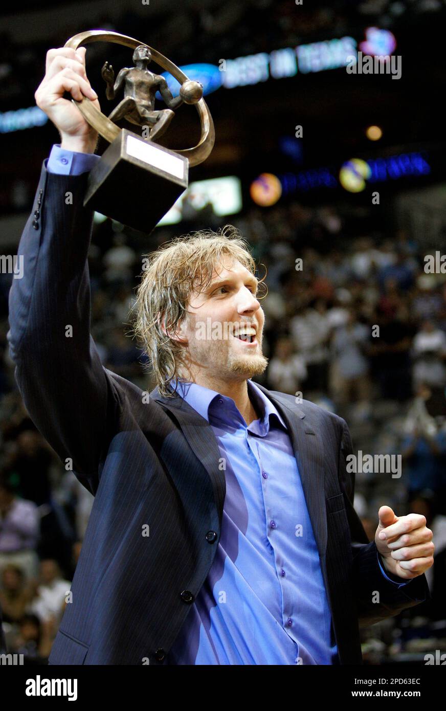 Dallas Mavericks Dirk Nowitzki of Germany holds up the innagural FIBA ...