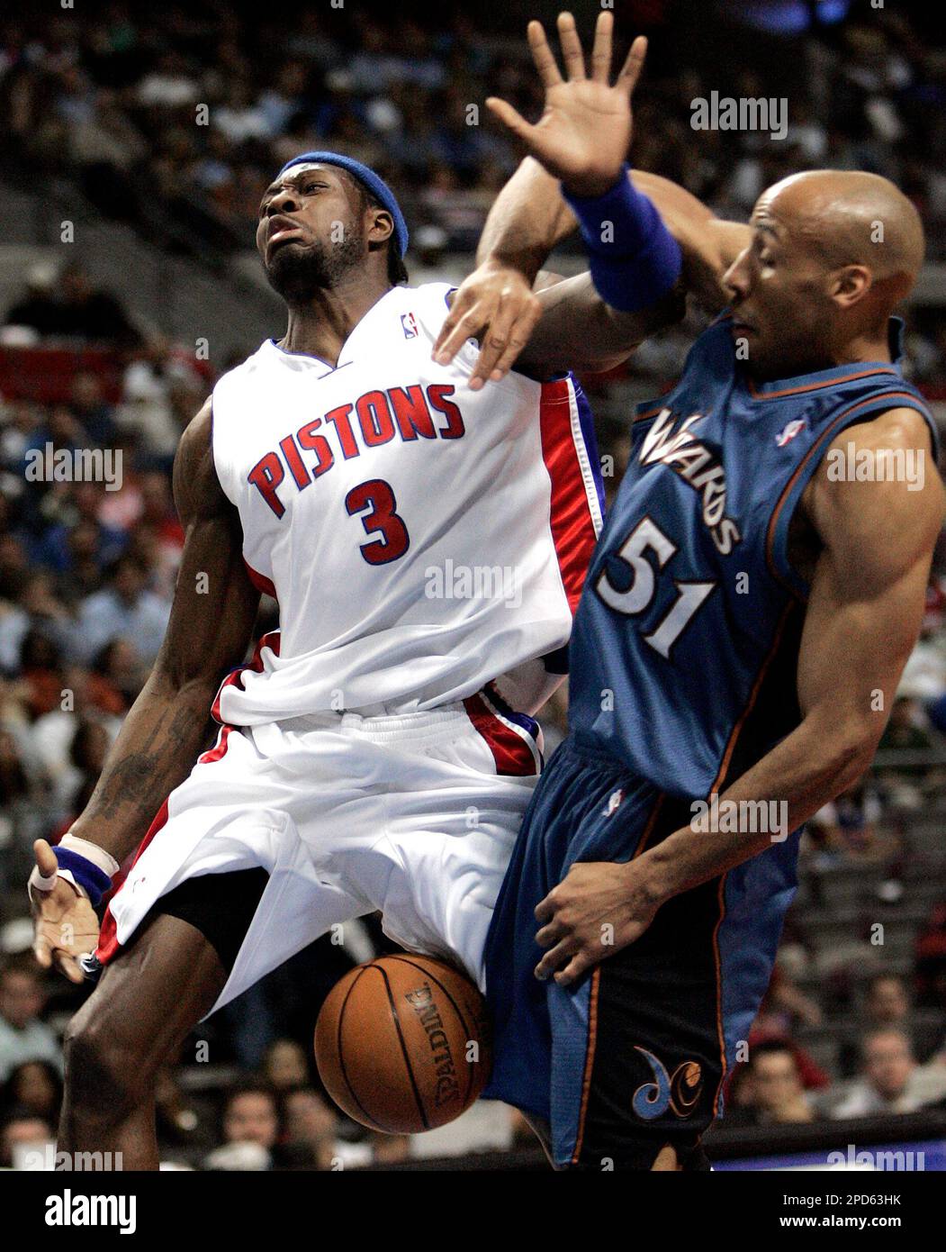 Detroit Pistons' Ben Wallace, left, is fouled by Washington Wizards ...