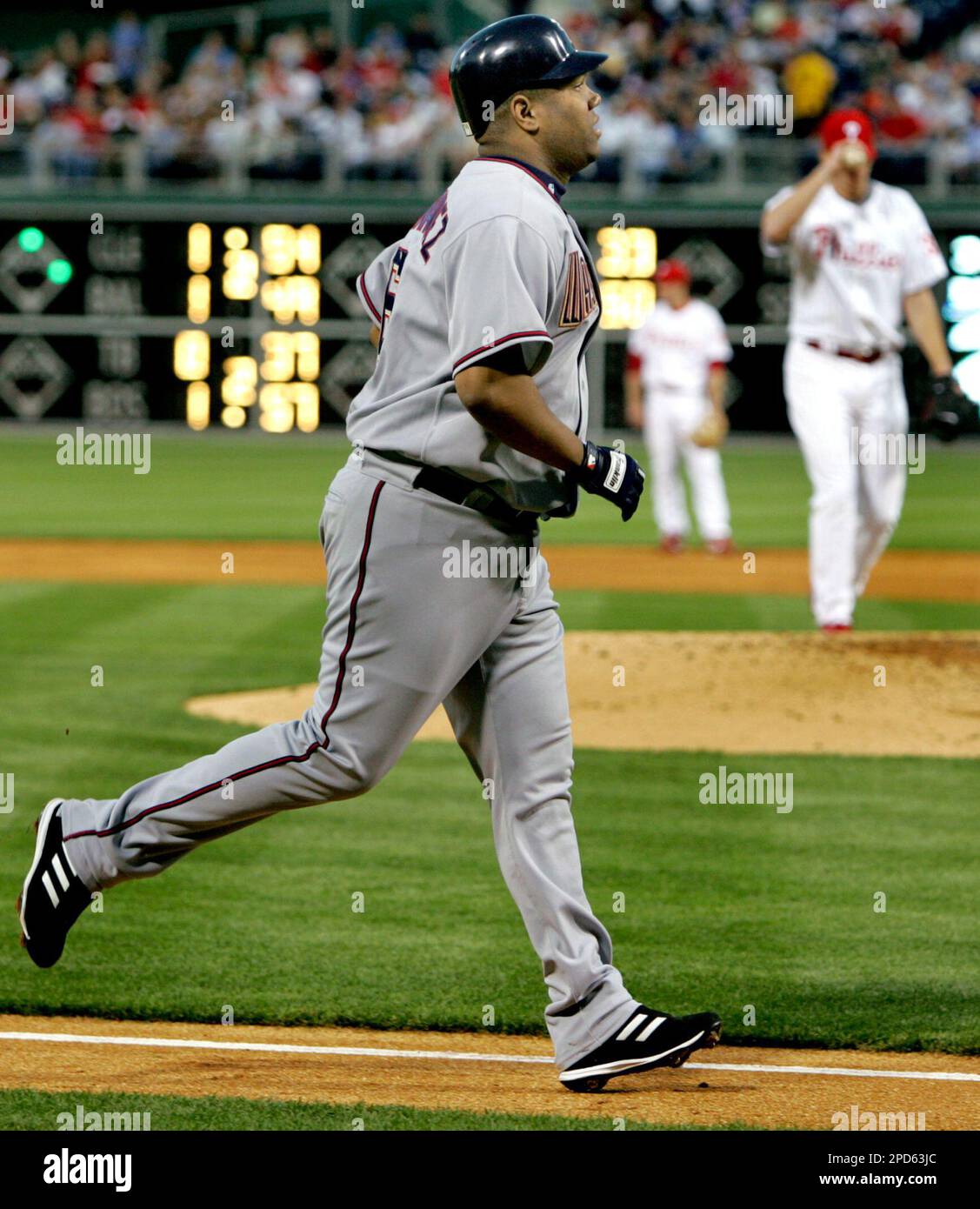 Washington Nationals pitcher Livan Hernandez heads to the plate past ...