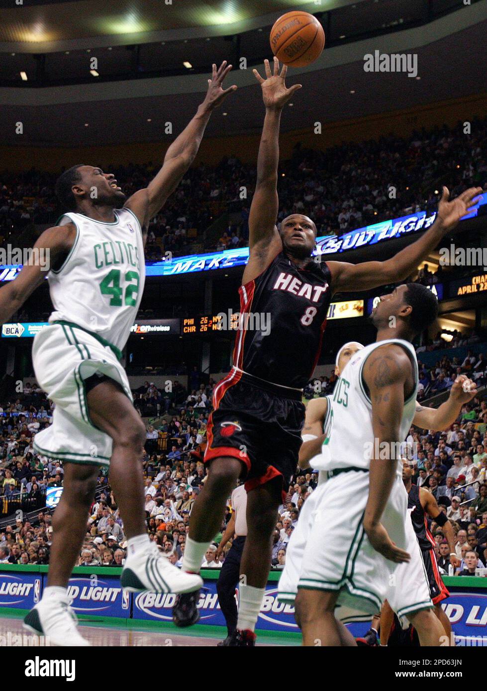Miami Heat's Antoine Walker (8) shoots as Boston Celtics' Tony Allen ...