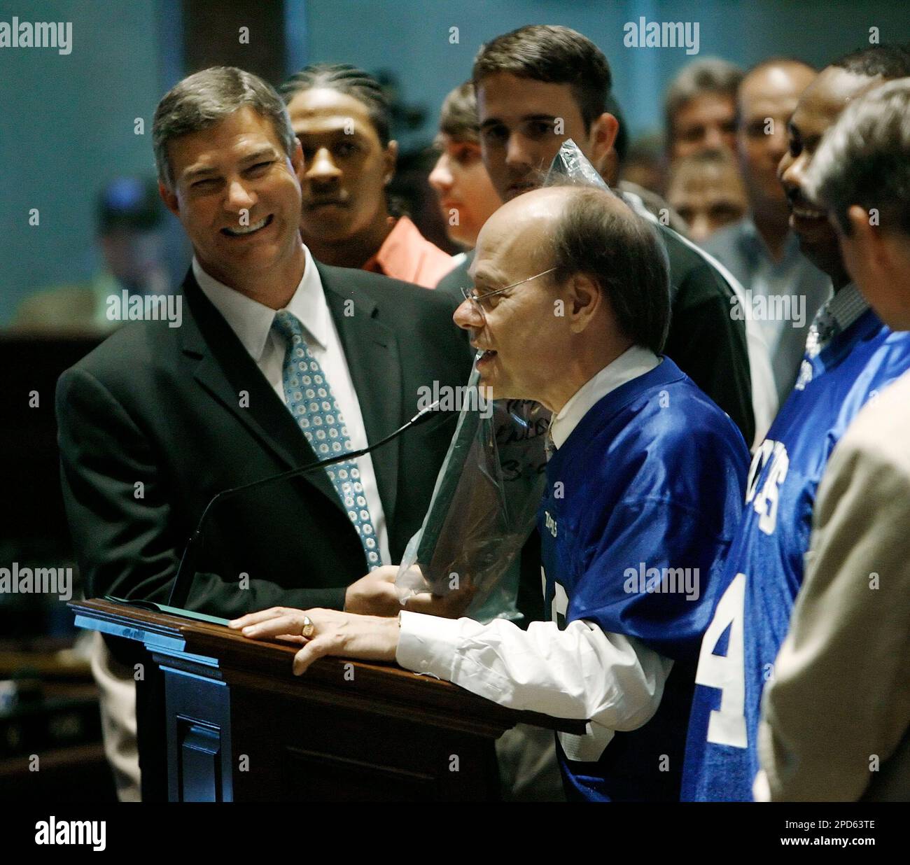 Tommy West, left, football coach at the University of Memphis, listens ...
