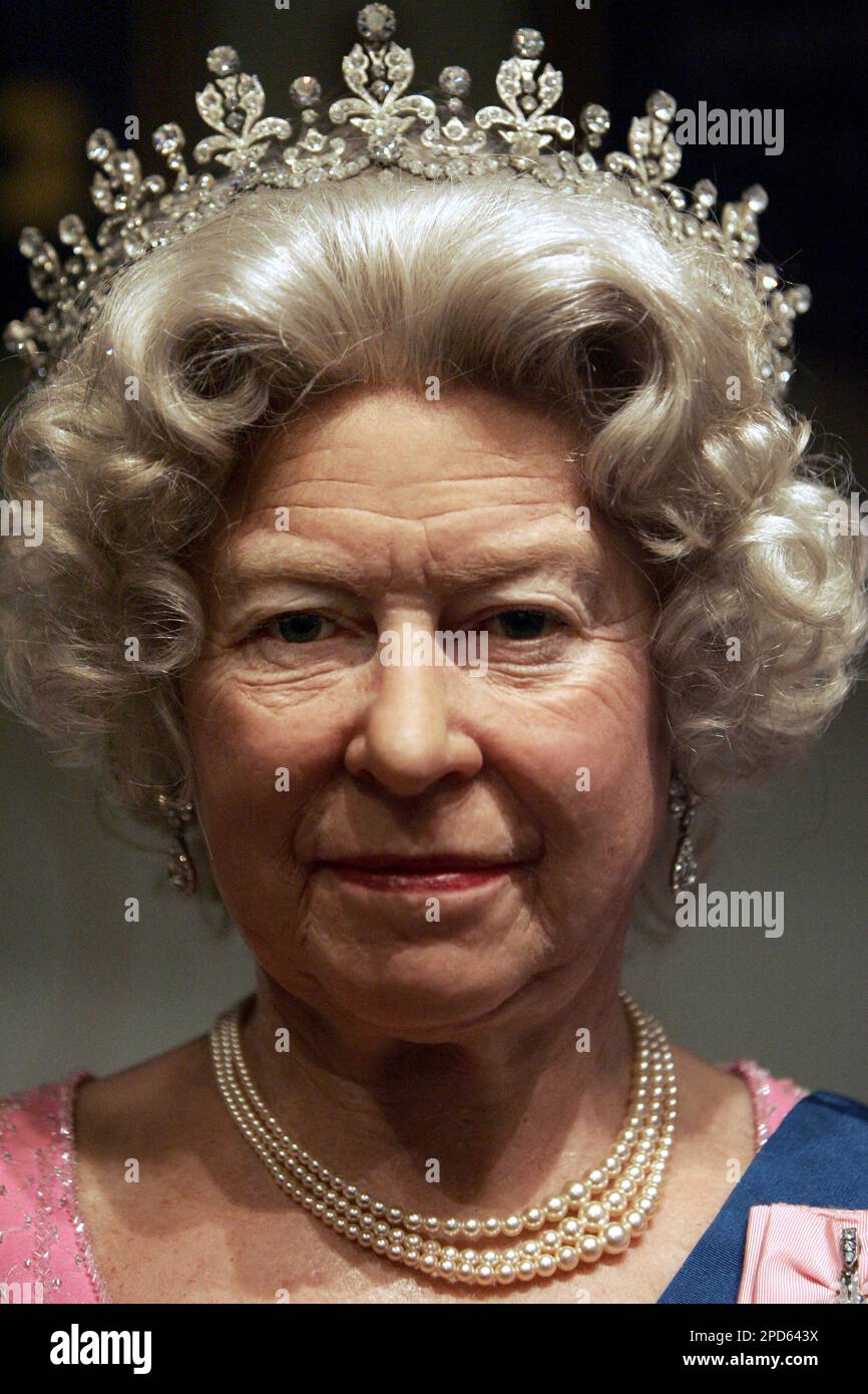 A wax figure of Queen Elizabeth II is seen during a music memorabilia ...