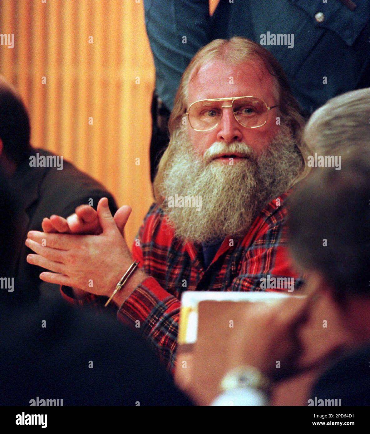 FILE--Death row inmate Robert "Mudman" Simon talks with his one of his ...