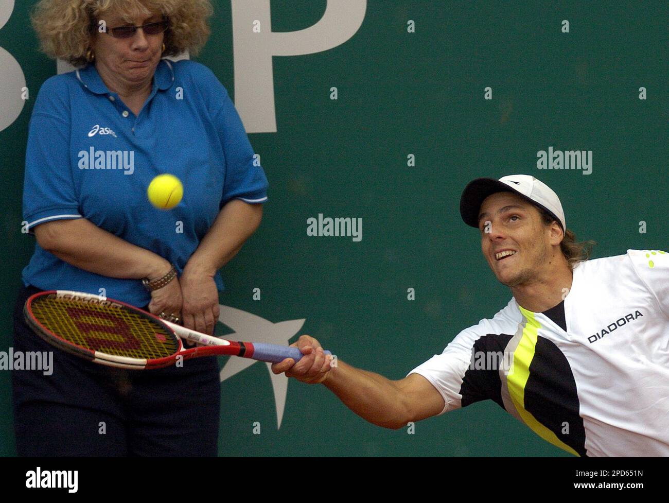 Gaston Gaudio of Argentina, returns a backhand to Jose Acasuso of ...