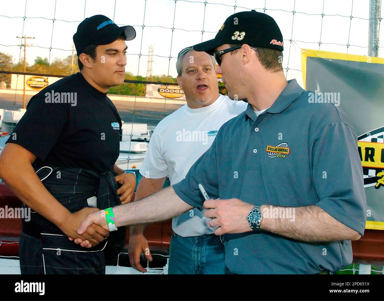 NASCAR driver Kevin Harvick, right, meets Nicholas Formosa, left, and ...