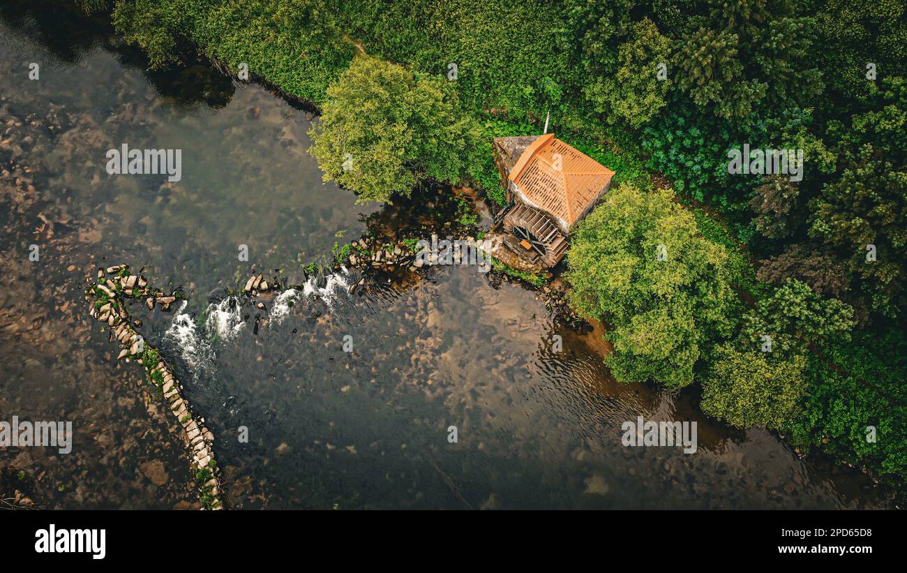Aerial view of a watermill in the forest Stock Photo - Alamy