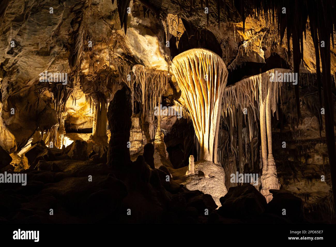 Inside a cave with calcium carbonate rock formation with stalactites ...