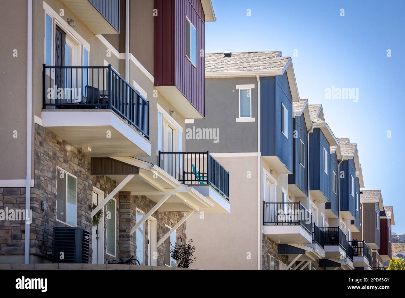 Angled Profile Exteriors of Upper Levels of Colorful Condo Homes in the ...