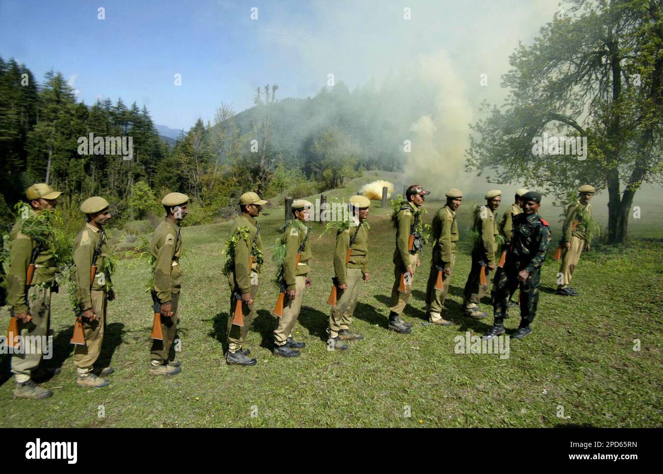 An Indian Army soldier. second right, instructs Jammu and Kashmir ...