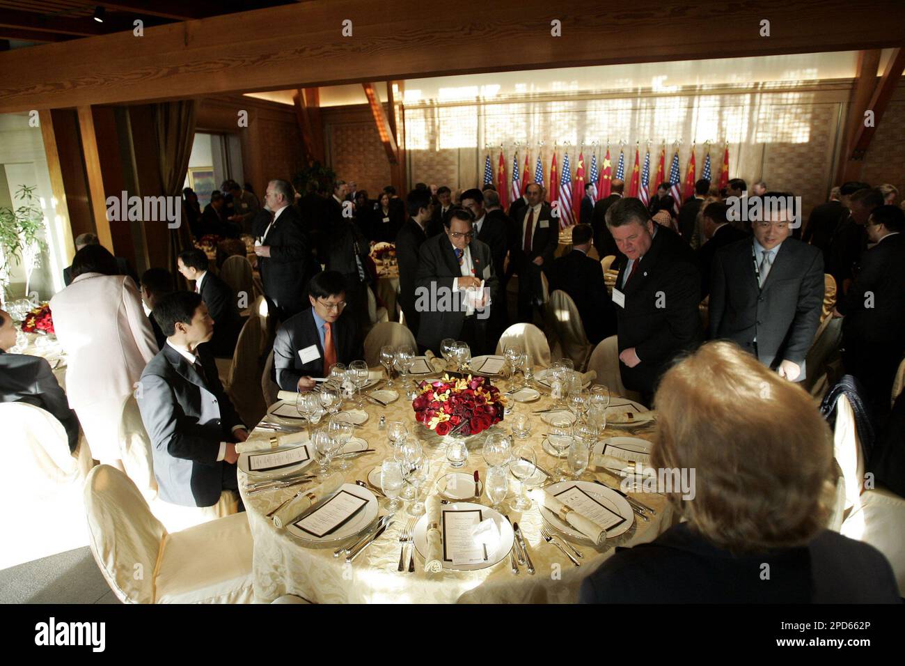 Guests, including Seattle Mayor Greg Nickels, second from right, look ...