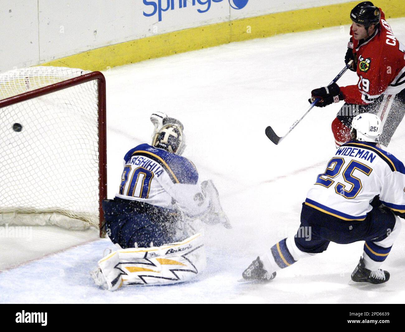 Chicago Blackhawks' Kyle Calder, top right, gets the puck past St ...
