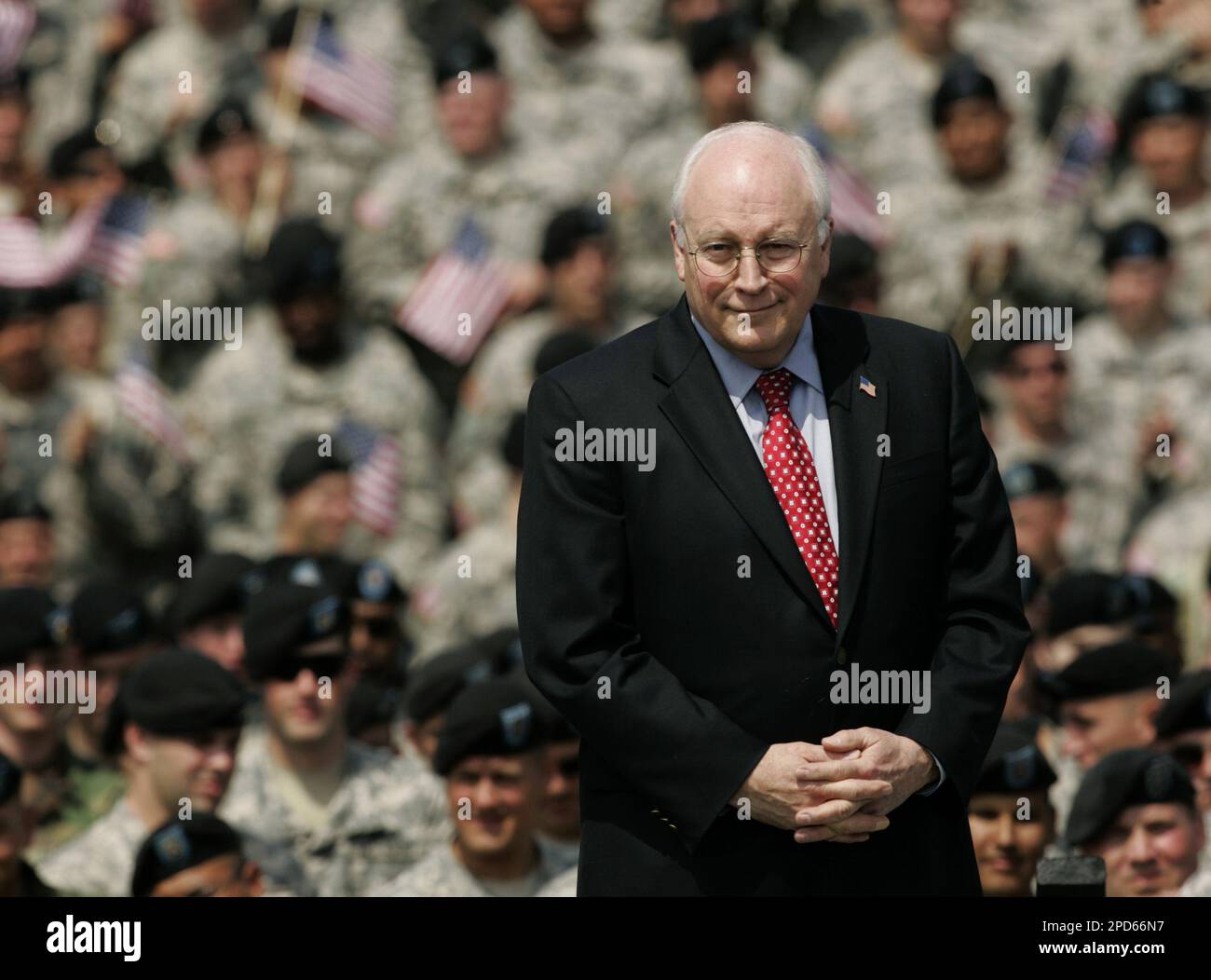 Vice President Dick Cheney looks out over a crowd of soldiers as he ...